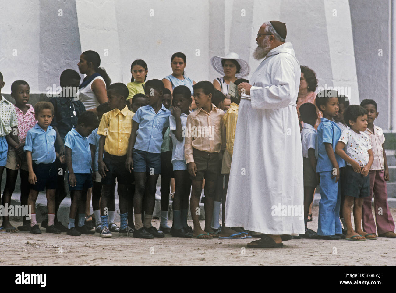 small boys with their priest in a Seychelles church Stock Photo - Alamy