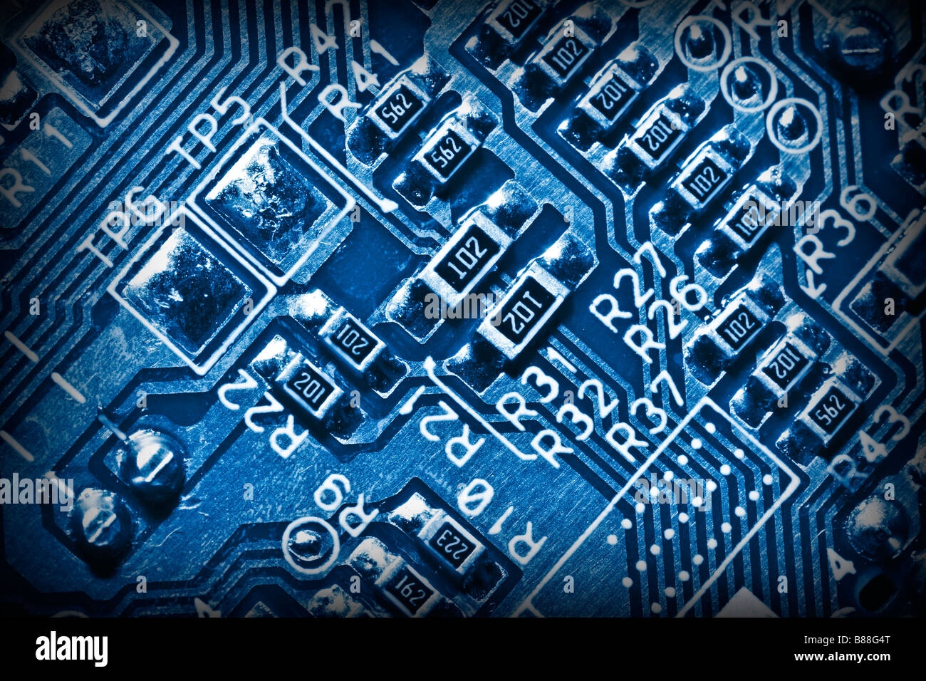 close up of electronic circuit blue background Stock Photo - Alamy