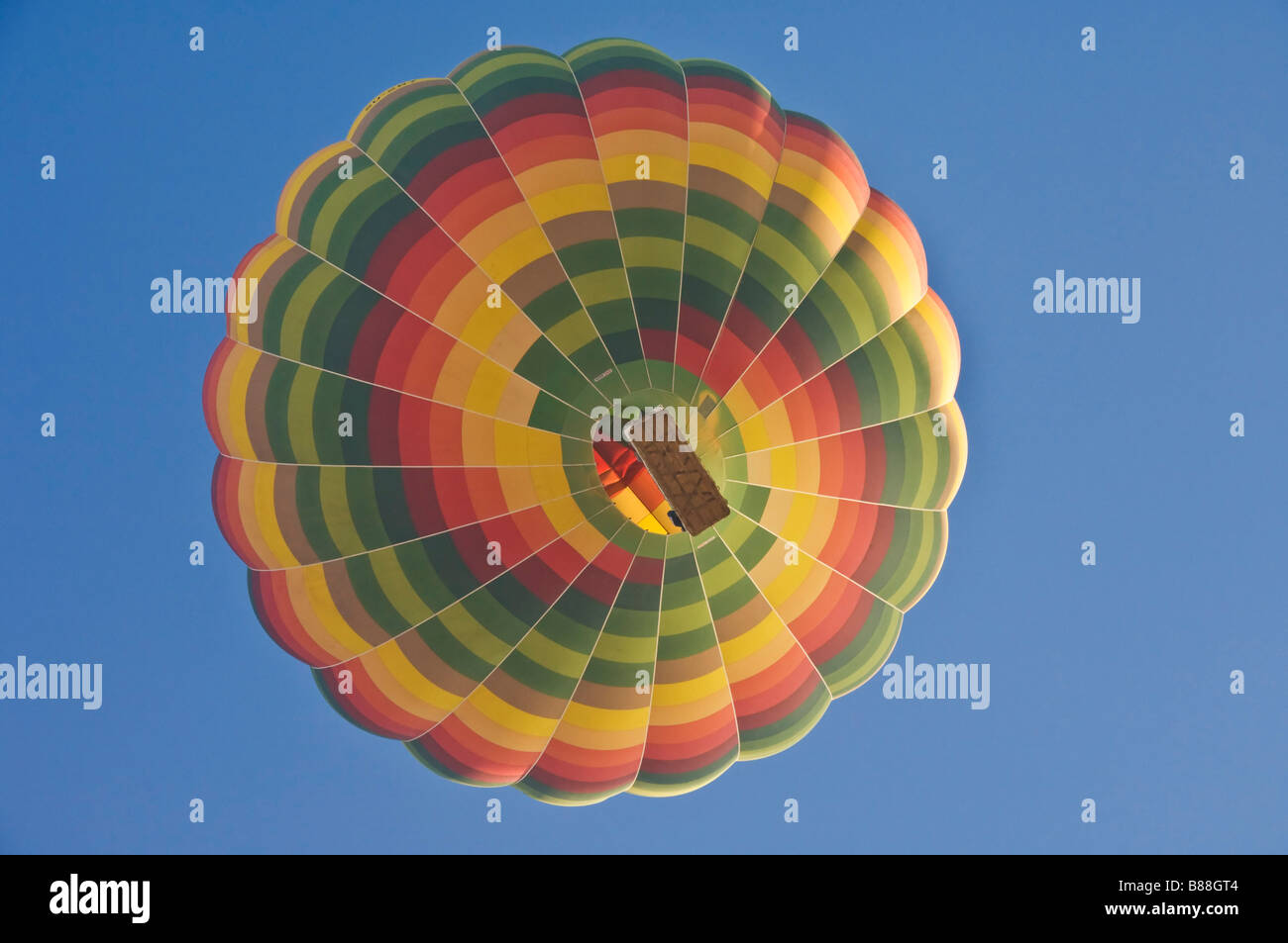 Looking up at a Hot air balloon flying Stock Photo - Alamy
