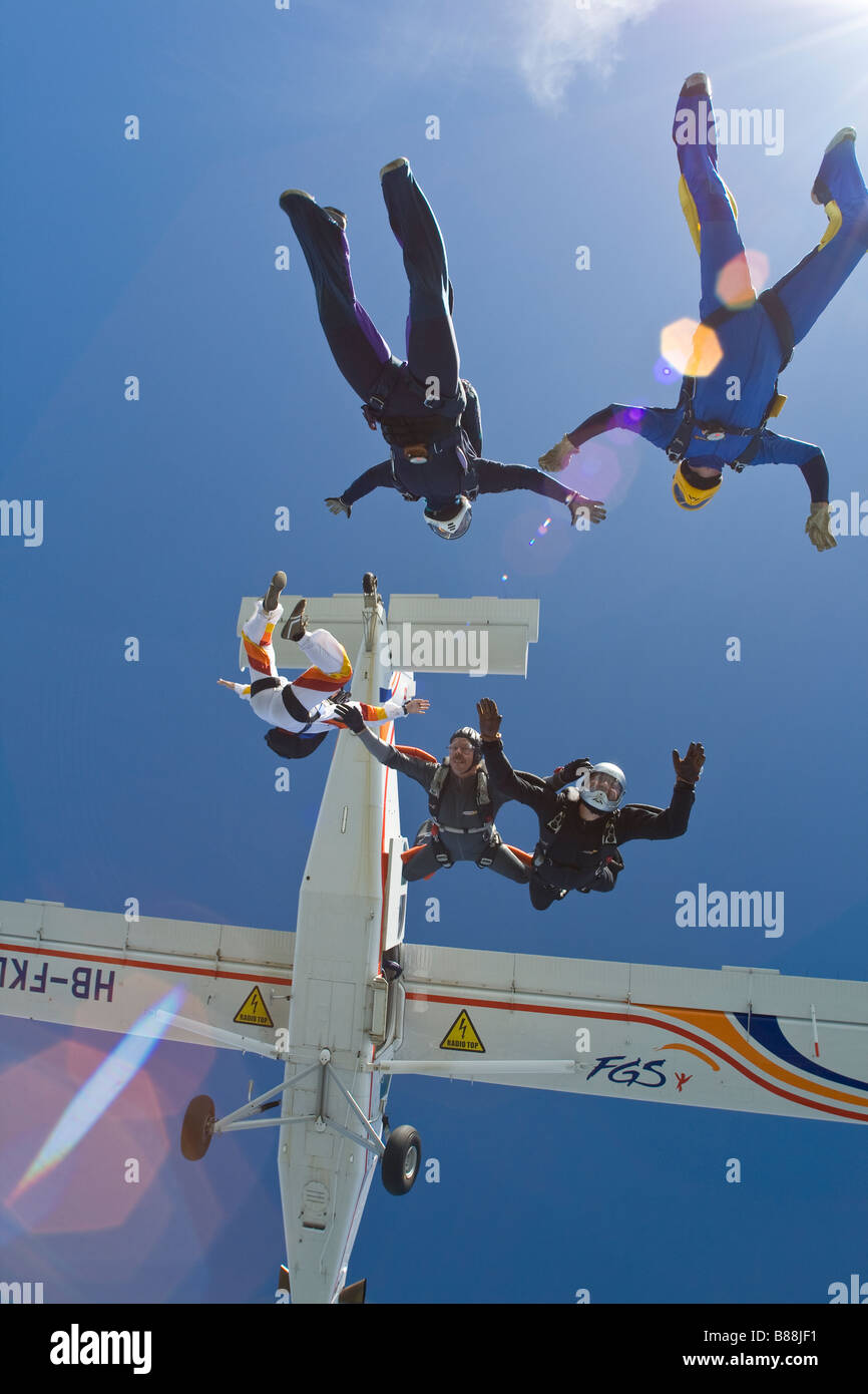 Skydiver team is exiting a plane and building a formation in the sky ...