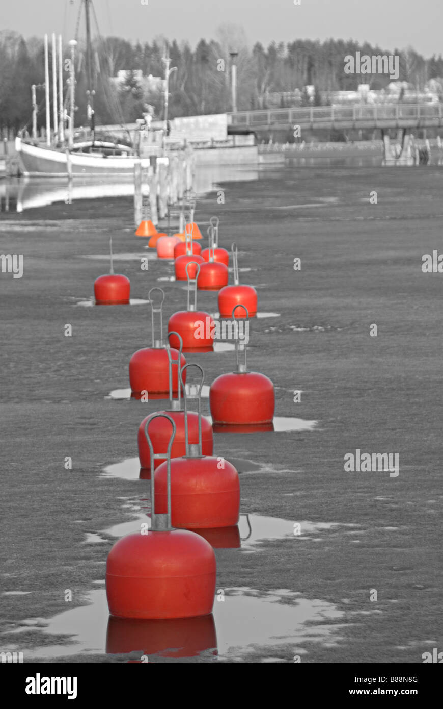 Partially desaturated image with striking red buoys leading towards ...