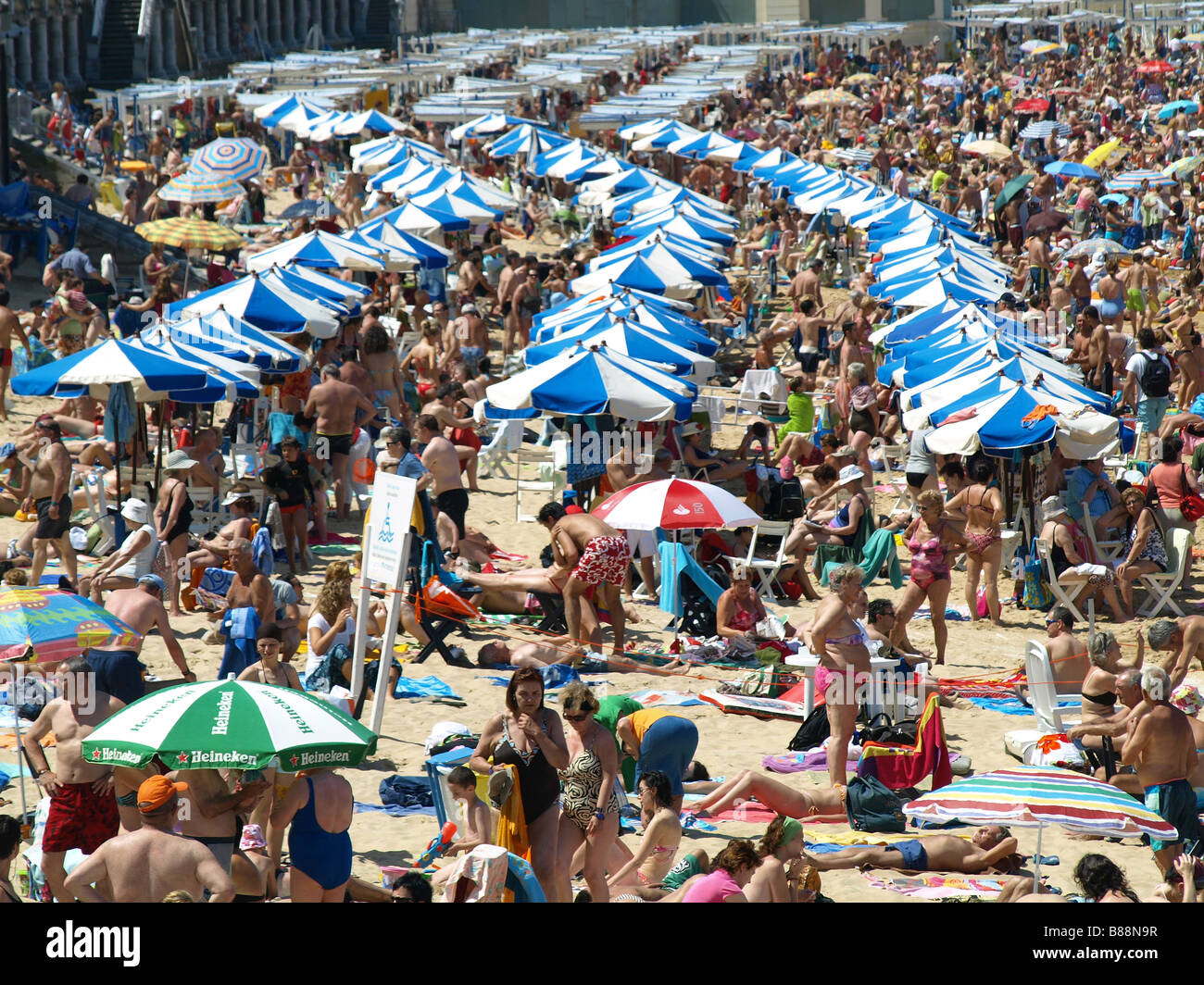 Crowded beach in San Sebatian beach Spain Stock Photo - Alamy