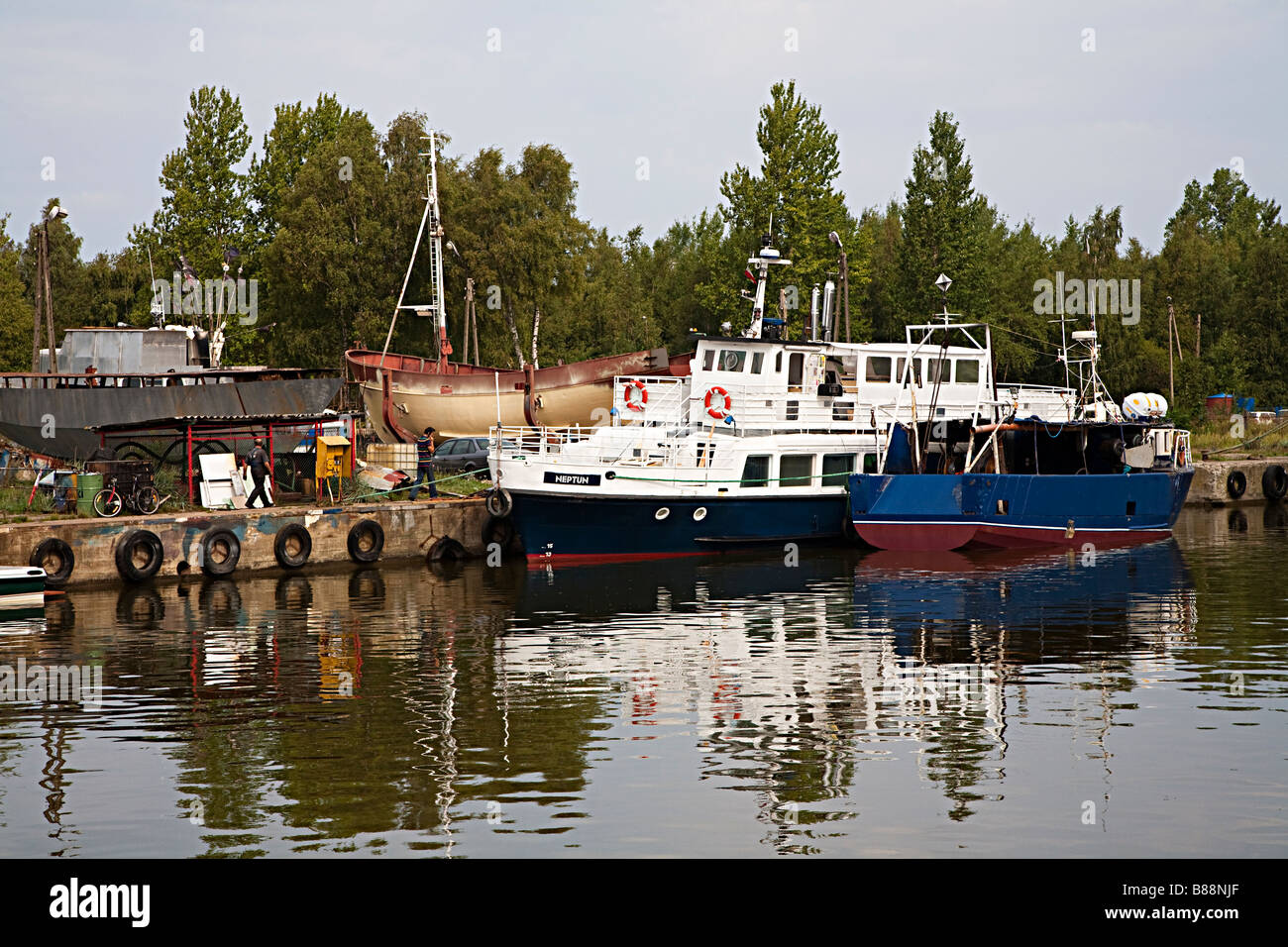 Boats in working harbour Leba Poland Stock Photo - Alamy