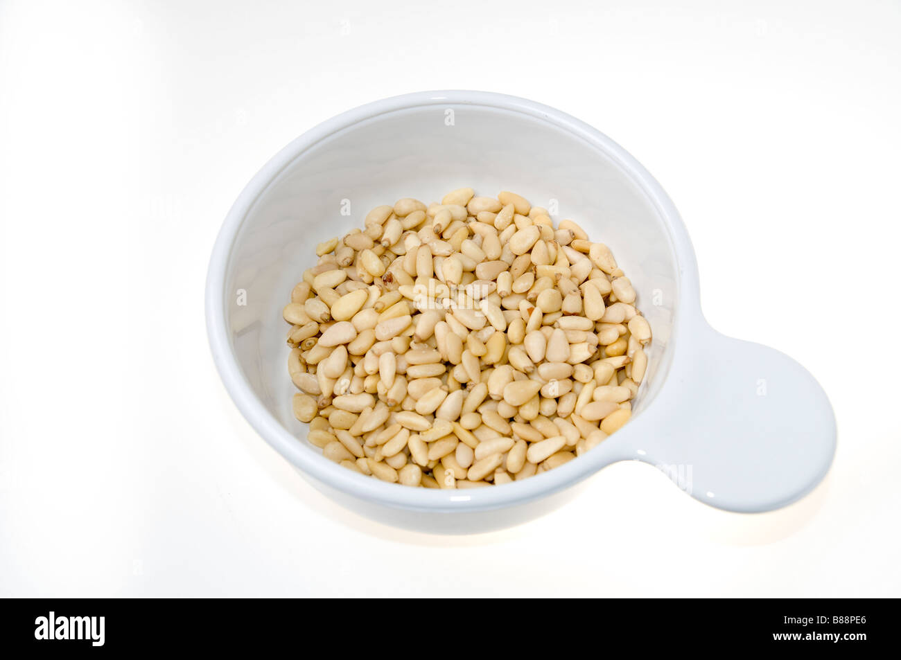 Pine nuts the edible seeds of stone pine tree Pinus pinea on white ...