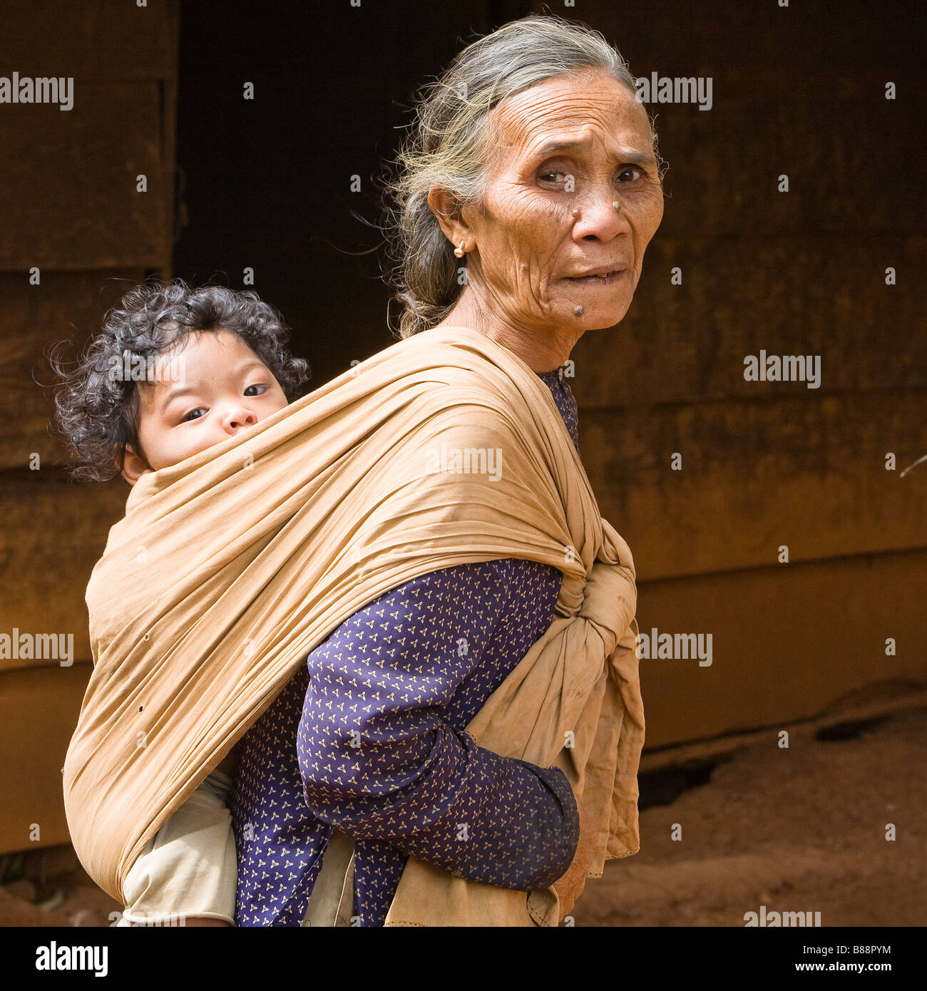 mother and baby on back in Vietnam village Stock Photo - Alamy