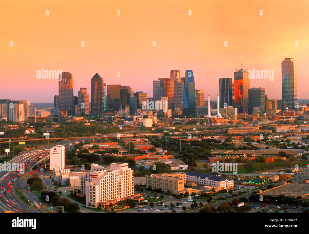 Highway traffic passing around Dallas skyline at dusk Stock Photo - Alamy