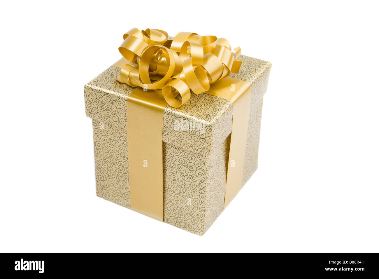 Beautiful golden gift on a over white background Stock Photo - Alamy