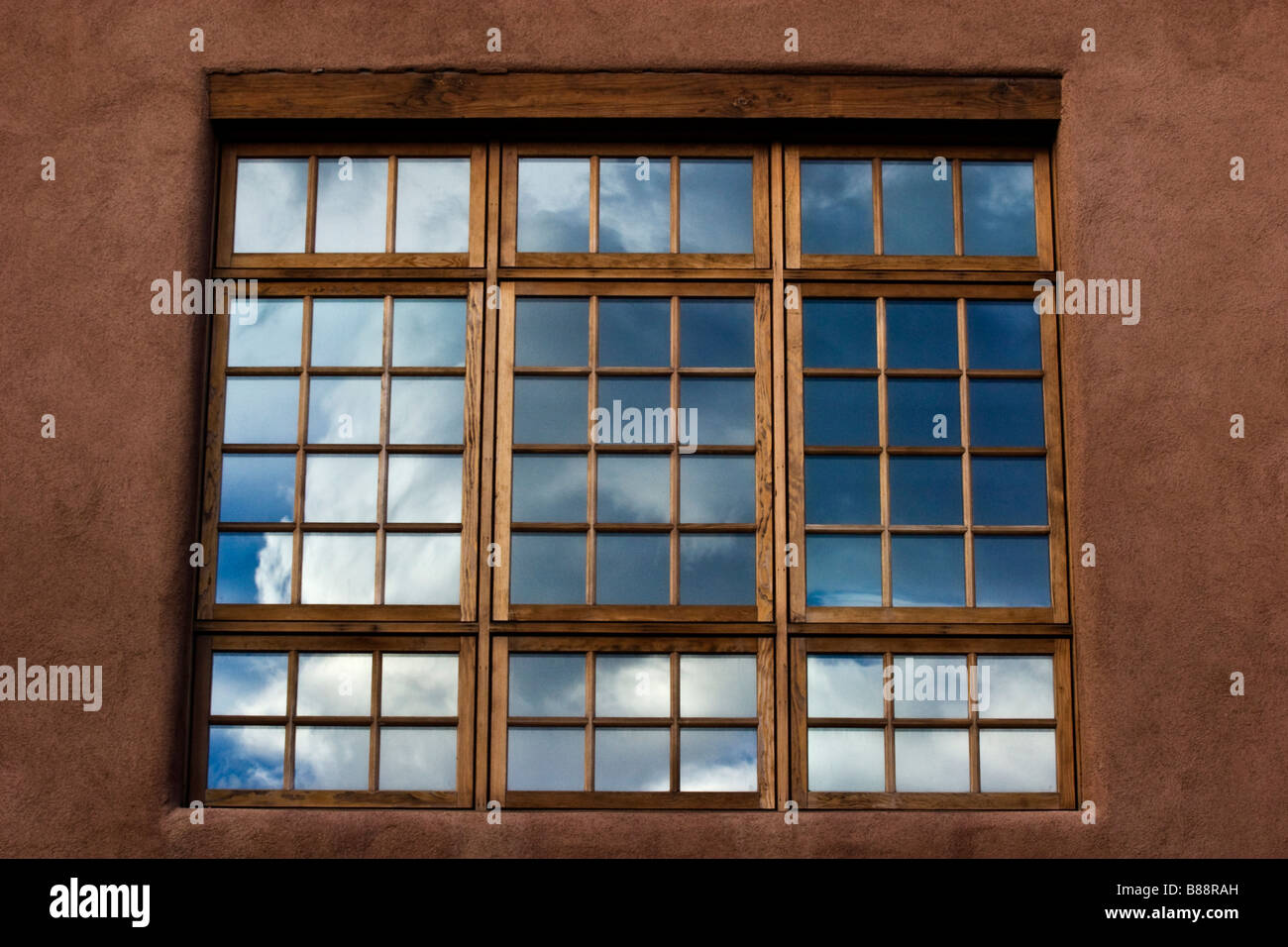 Blue sky and white clouds reflected in window in Santa Fe, New Mexico ...