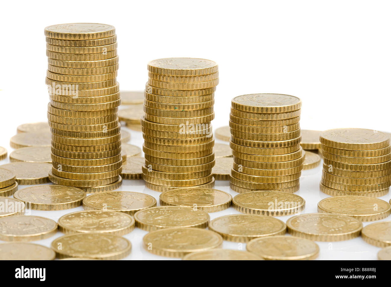 Four piles of money isolated on white Stock Photo - Alamy