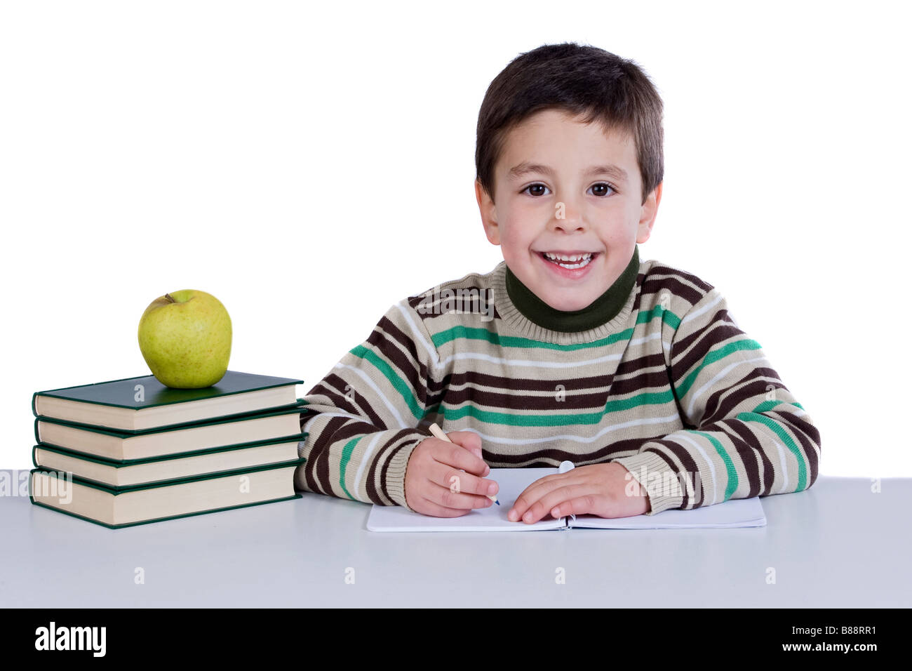 Adorable child writing in the school on a over white background Stock ...