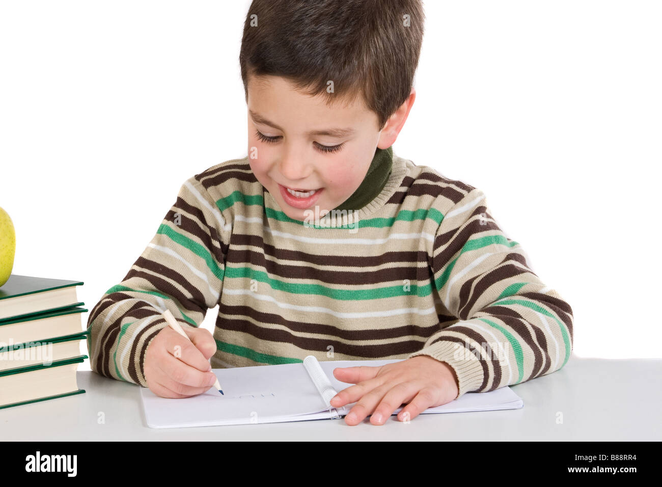 Adorable child writing in the school on a over white background Stock ...