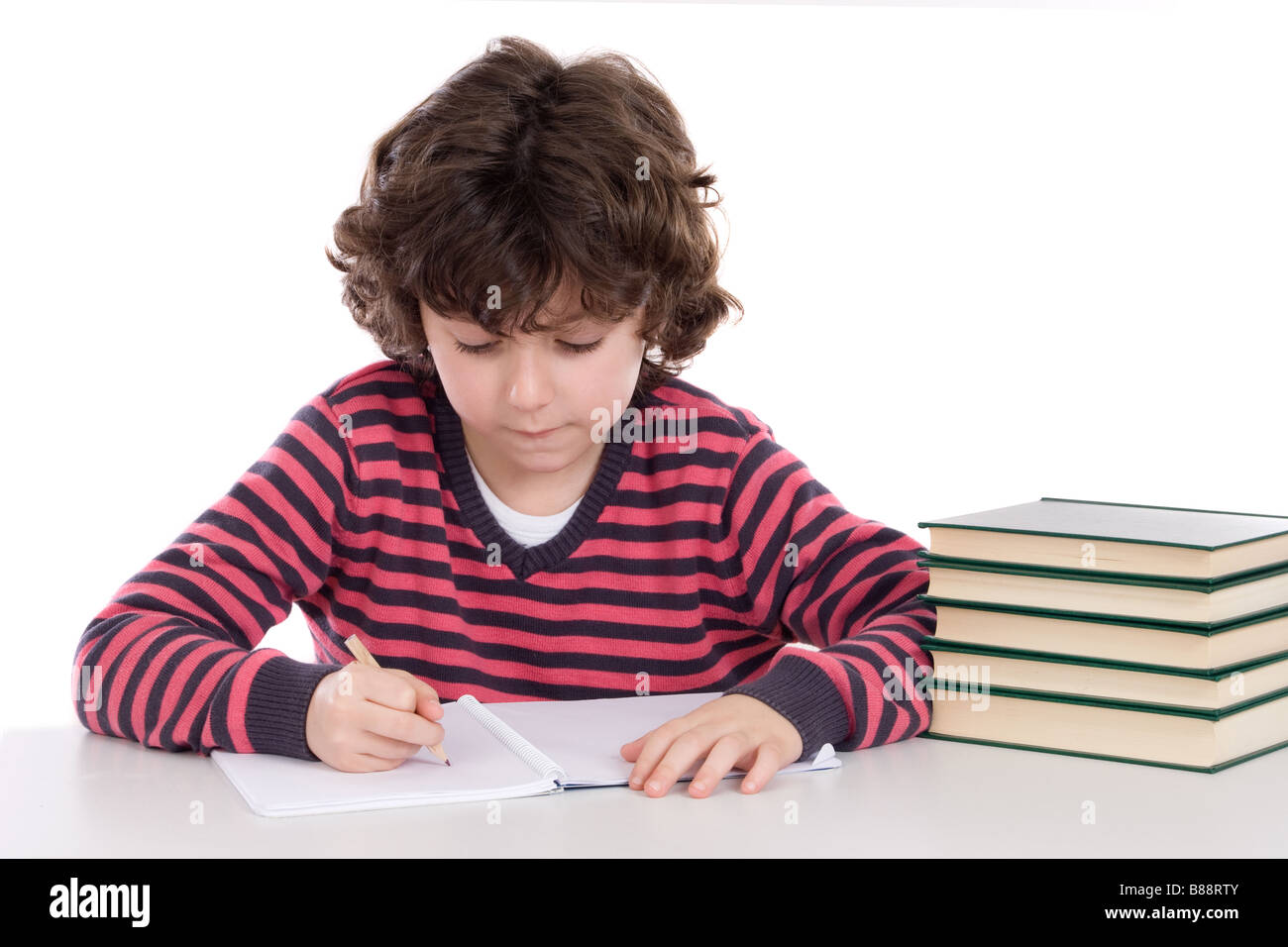 Adorable child writing in the school on a over white background Stock ...