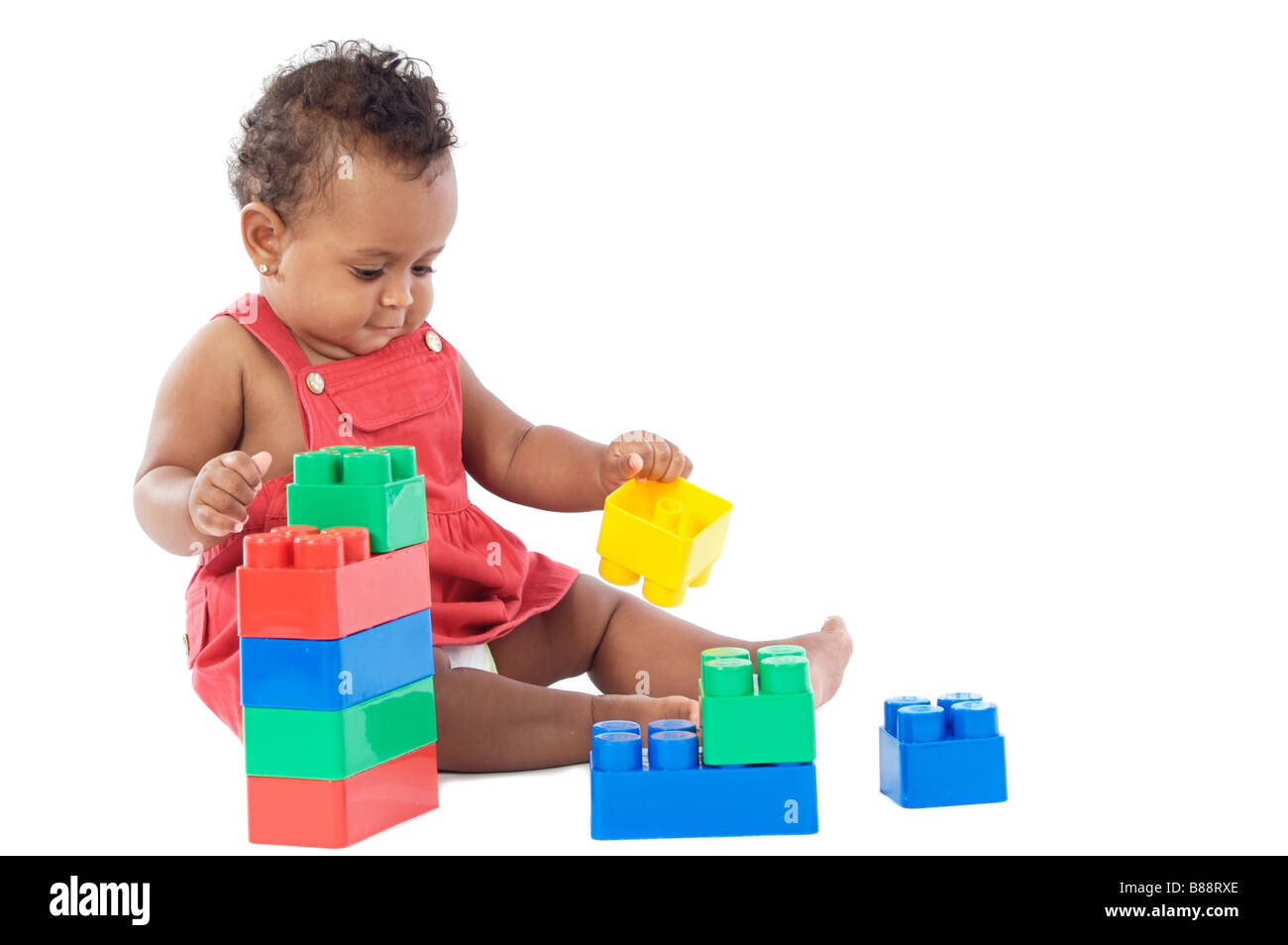 Adorable baby girl playing with building blocks Stock Photo - Alamy