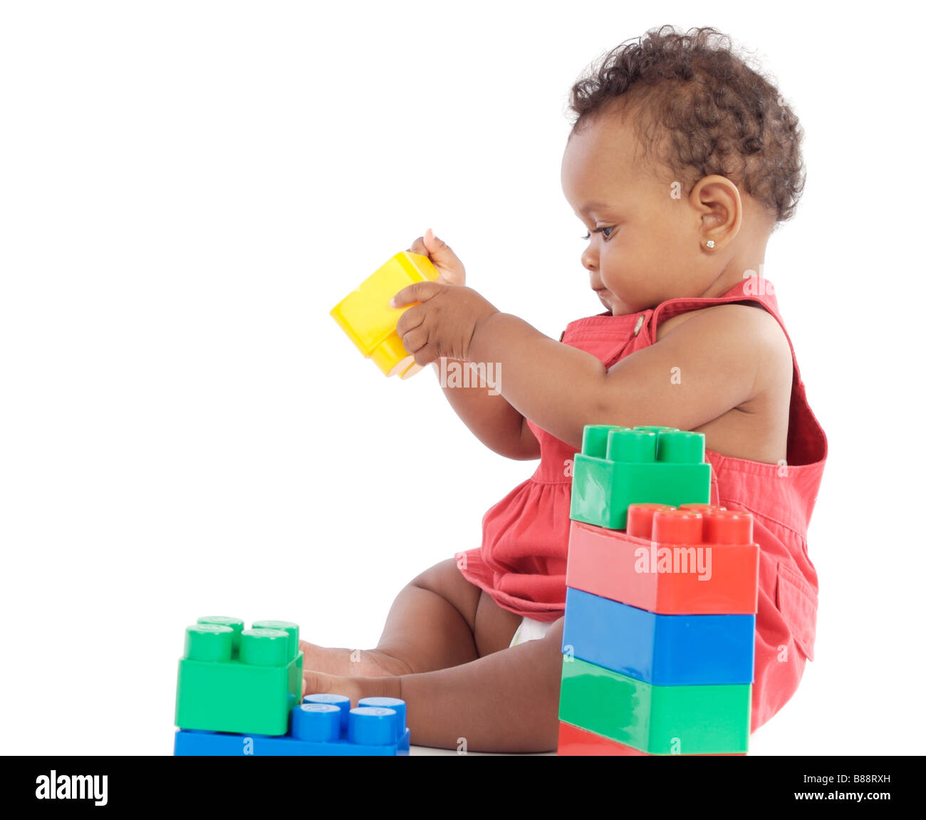 Adorable baby girl playing with building blocks Stock Photo - Alamy