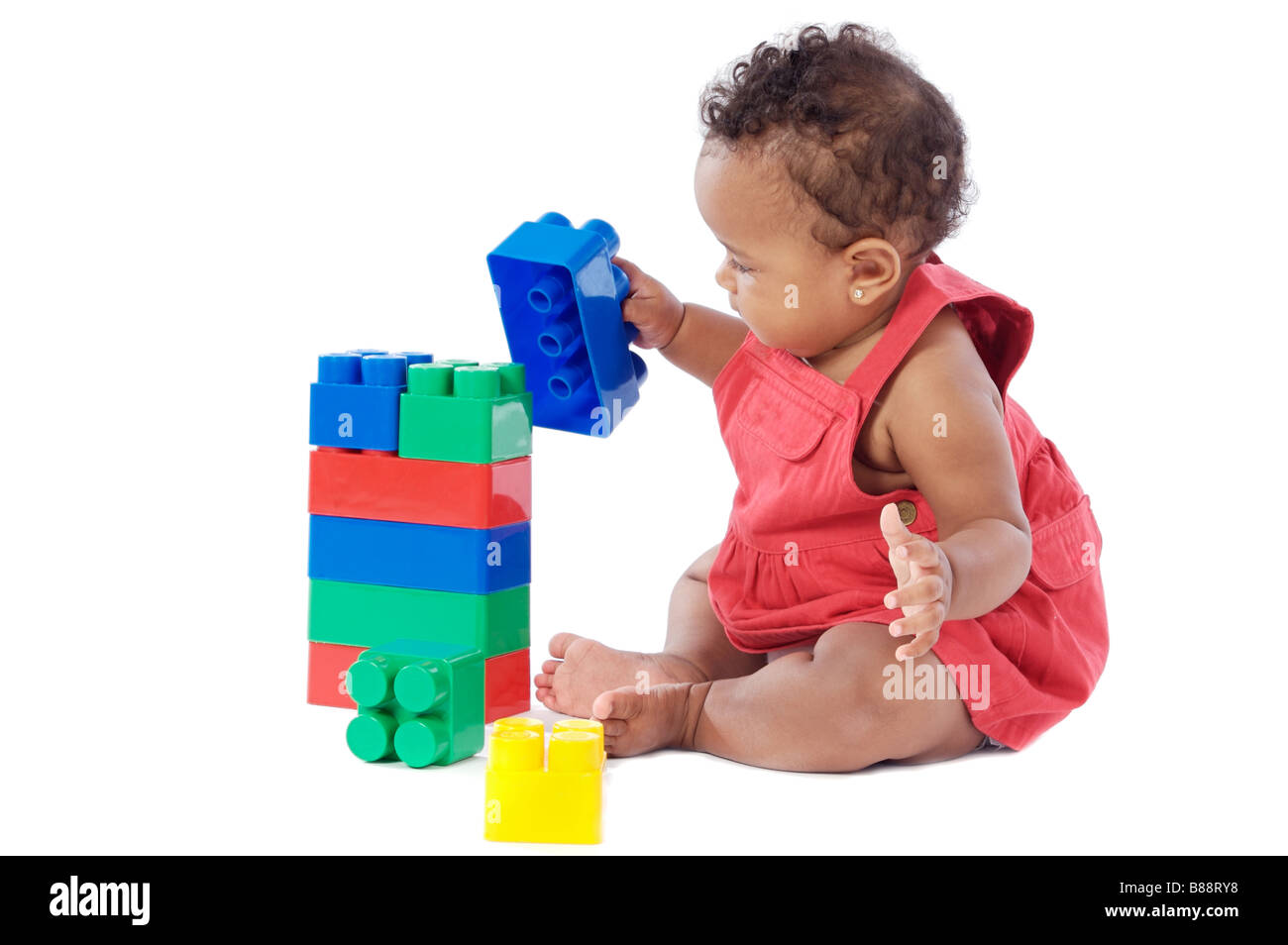 Adorable baby girl playing with building blocks Stock Photo - Alamy