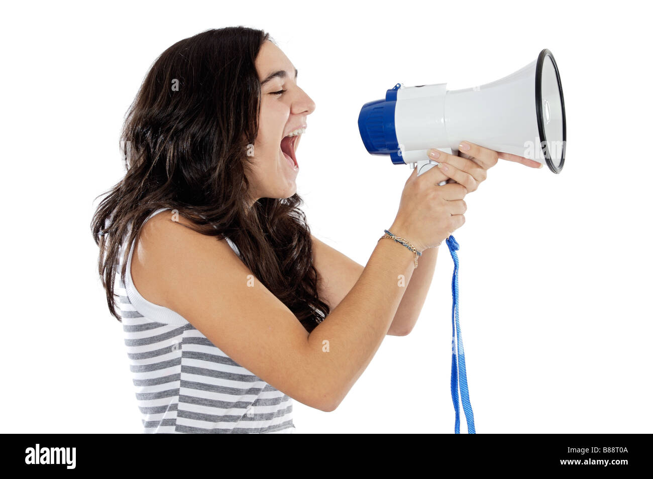 Teenager speaking through a megaphone over white background Stock Photo ...