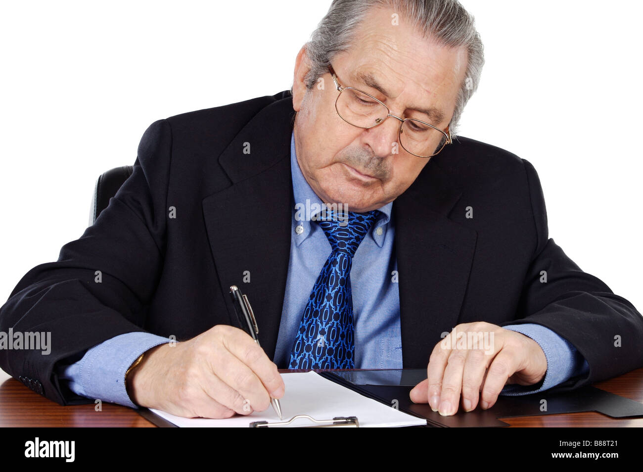 Senior businessman taking notes a over white background Stock Photo - Alamy
