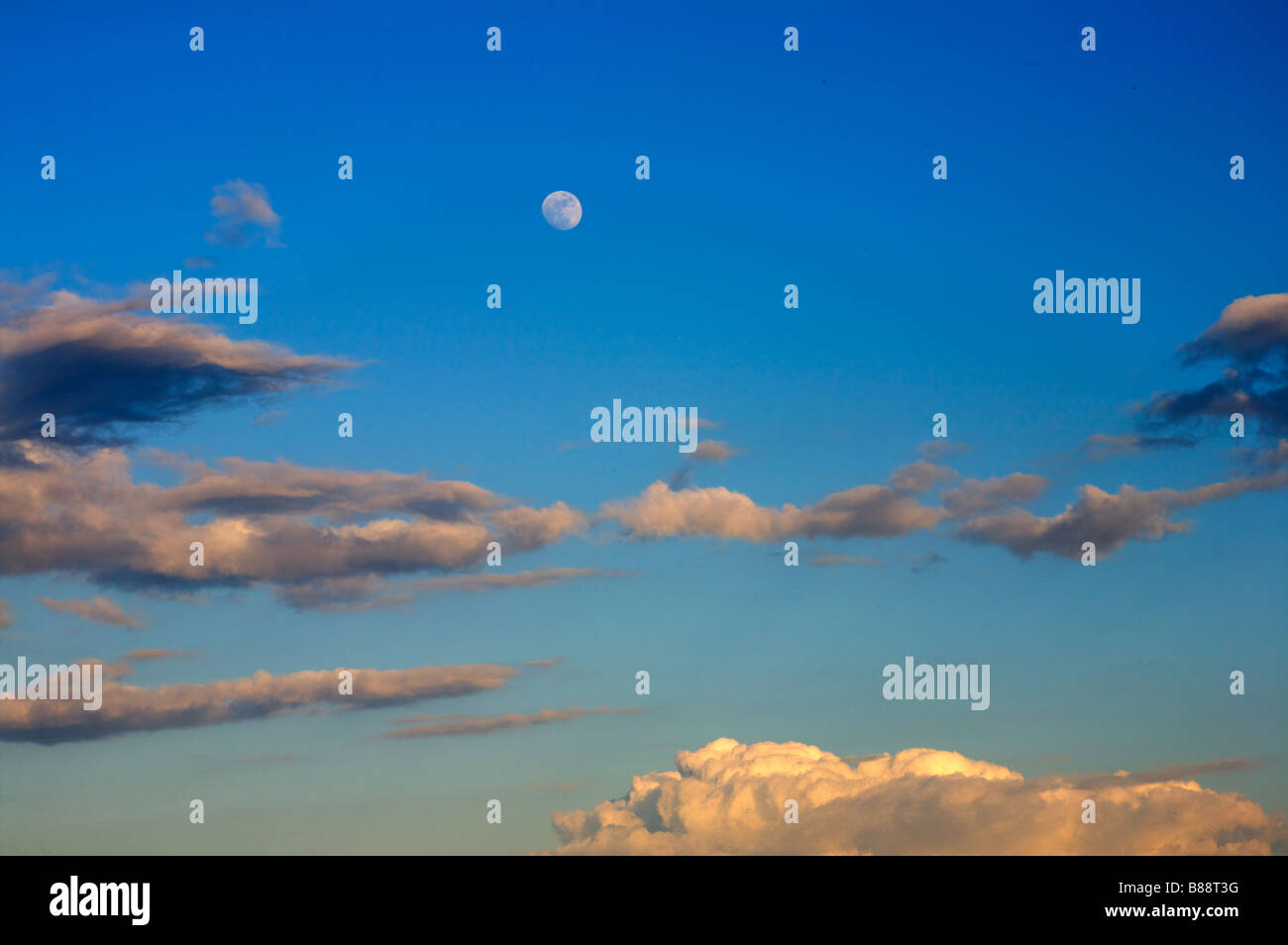 Beautiful blue sky at dusk with full moon Stock Photo - Alamy