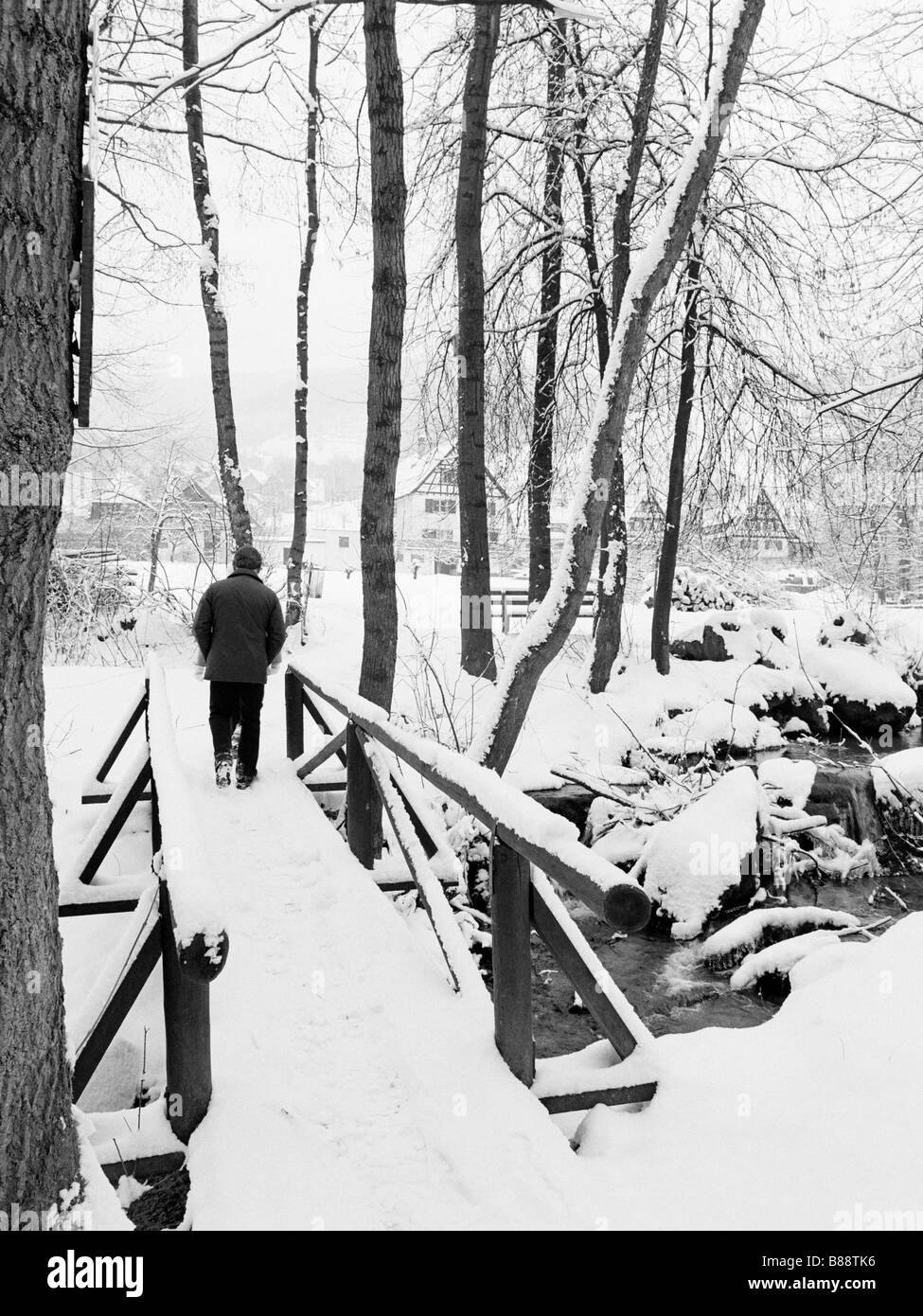 Man crossing footbridge Black and White Stock Photos & Images - Alamy