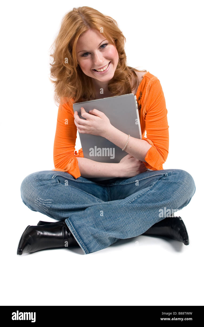 Portrait of a teenager sitting with a laptop computer Stock Photo - Alamy