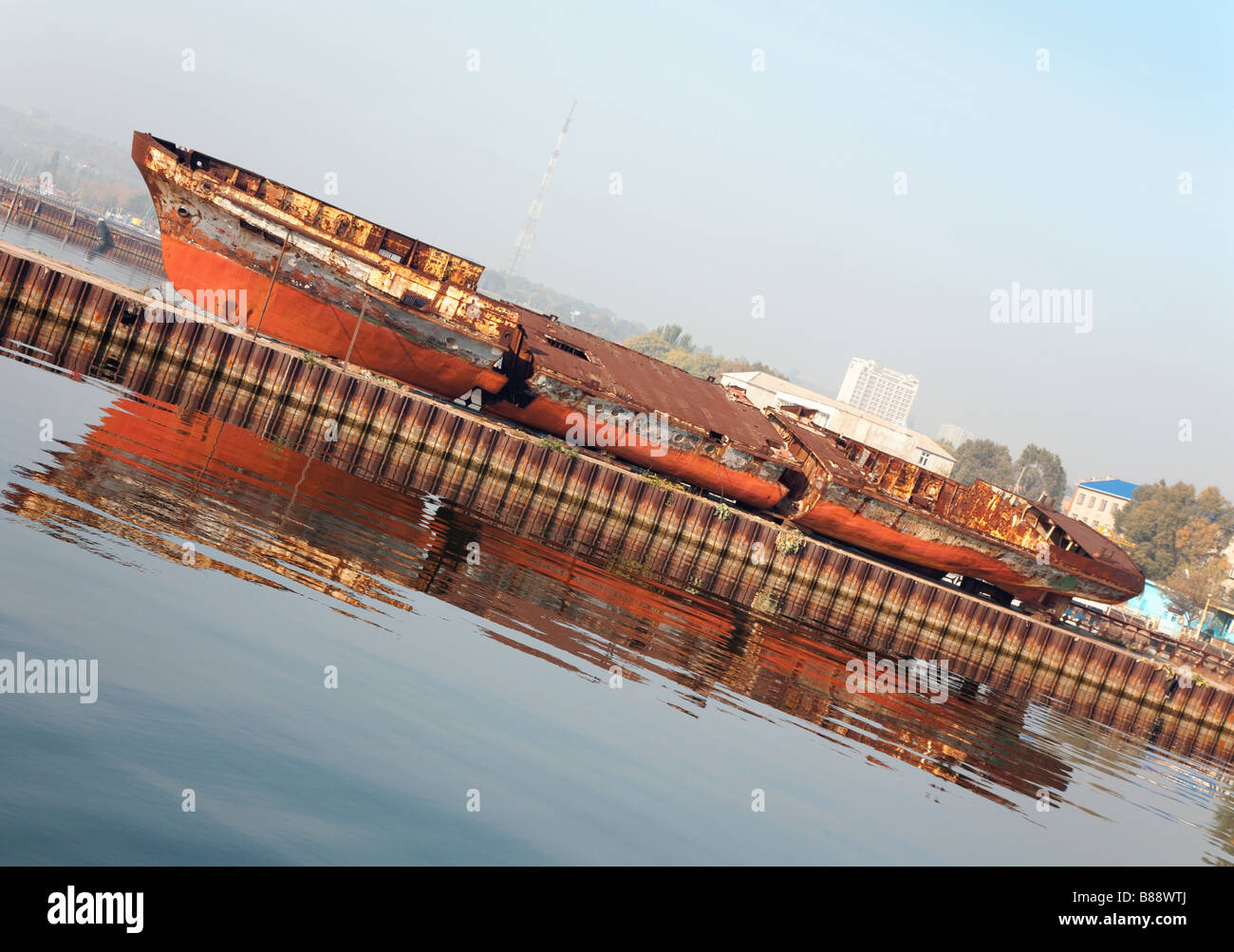 destroyed splitted on three part ship on sea port jetty (Mariupolj Town ...