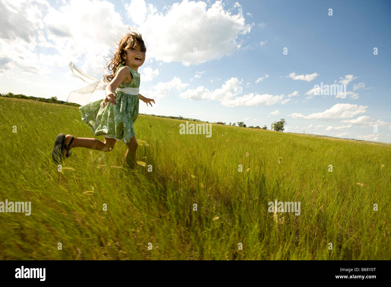 Girl Running Through Tall Grass High Resolution Stock Photography and ...