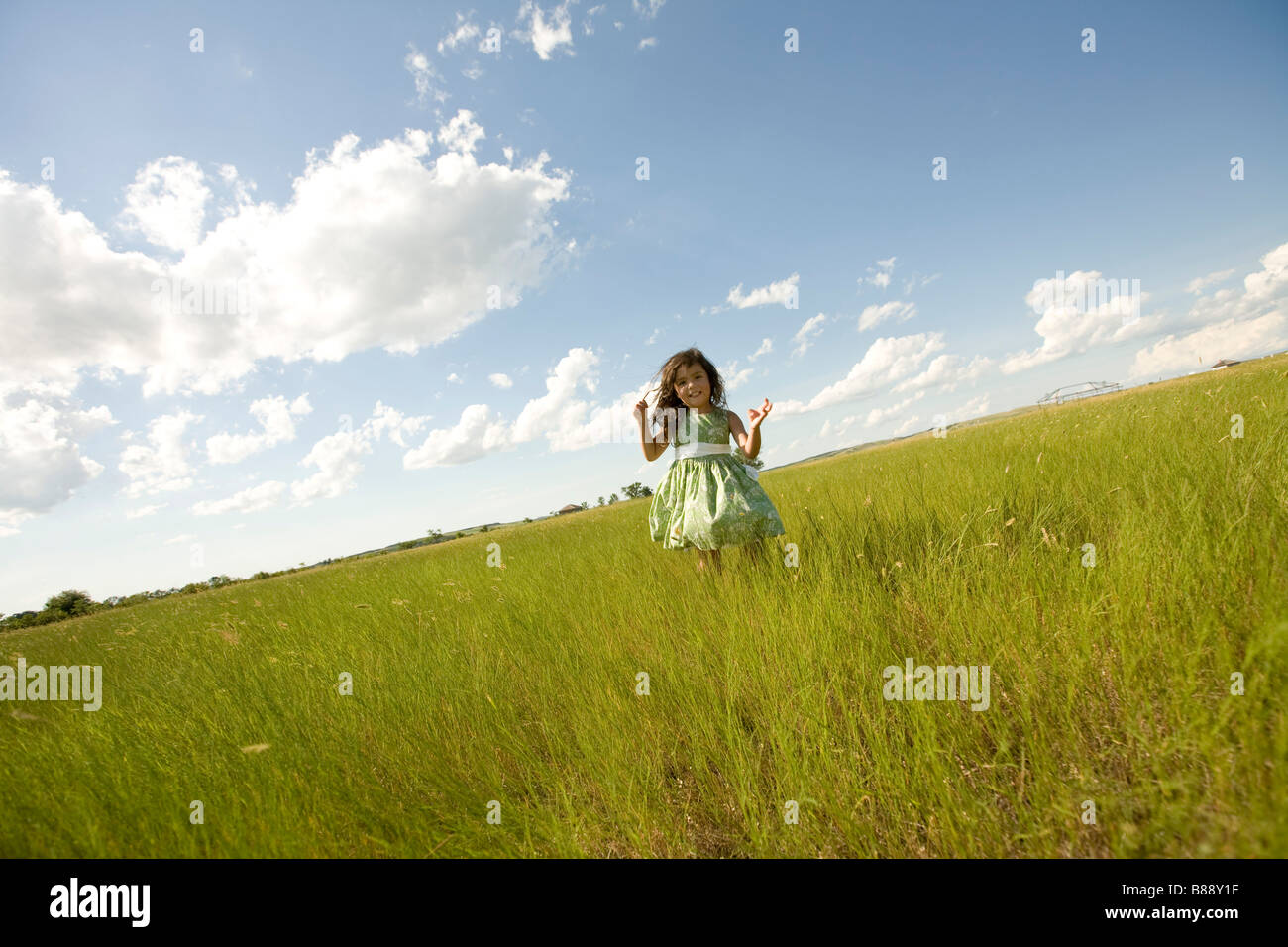 Girl running through tall grass hi-res stock photography and images - Alamy