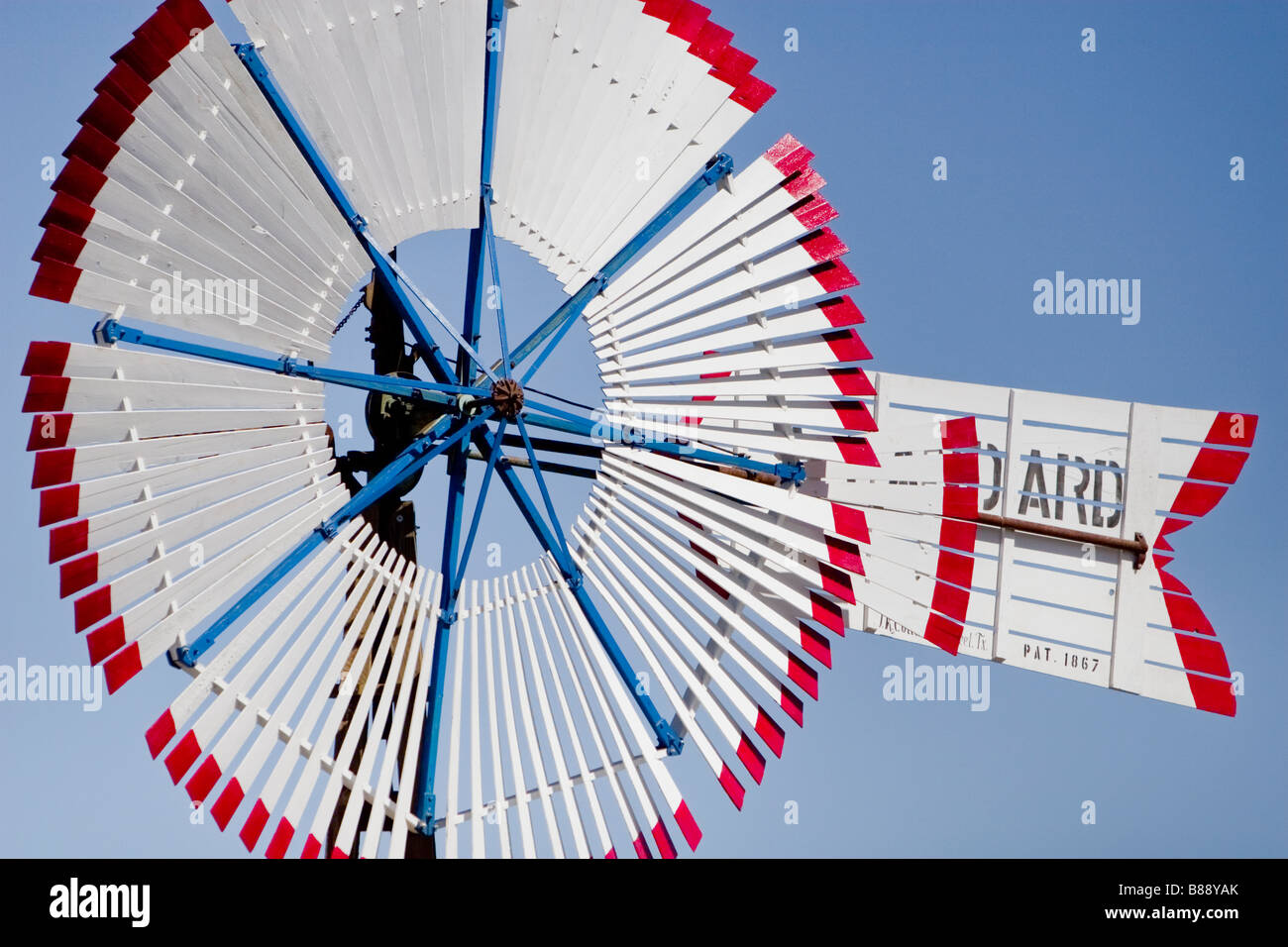 Red and white painted wooden windmill Stock Photo - Alamy