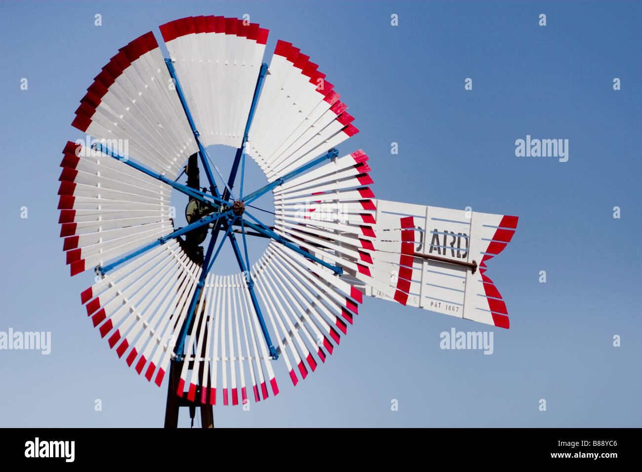 Red and white painted wooden windmill Stock Photo - Alamy