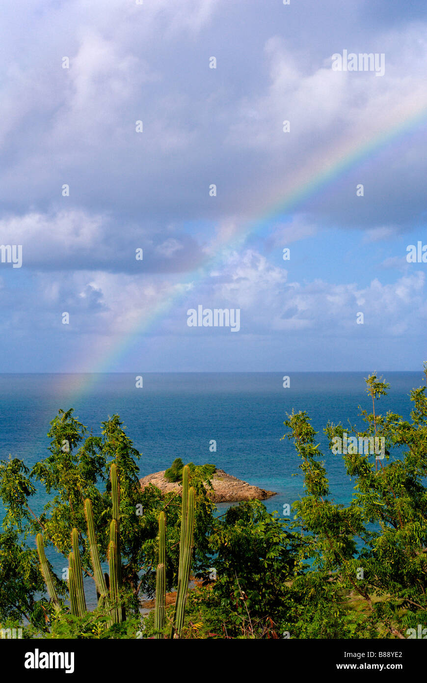 Rainbow on a background of pure heaven Stock Photo - Alamy