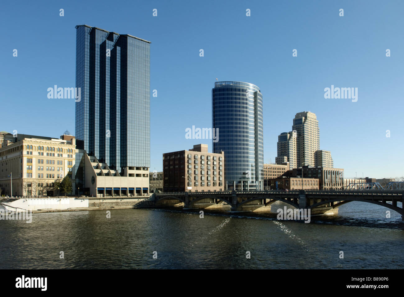 Buildings and bridge on the Grand River in Grand Rapids Michigan USA ...