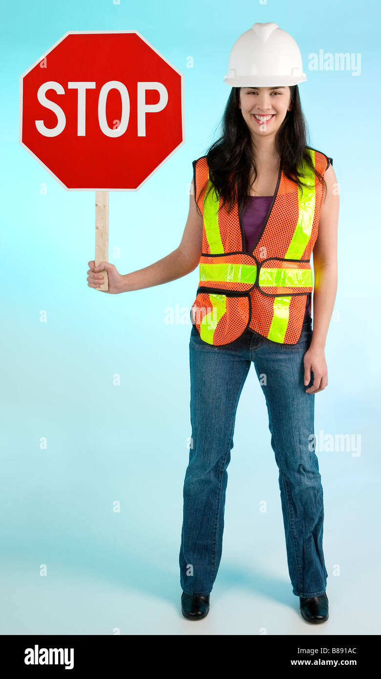 Road worker holding stop sign hi-res stock photography and images - Alamy