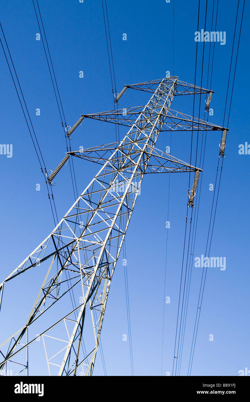 Electricity pylon with clear blue sky background Stock Photo - Alamy