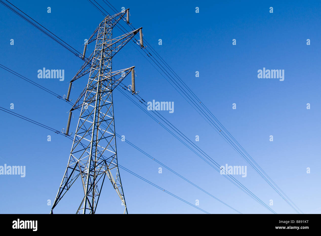 Electricity pylon with clear blue sky background Stock Photo - Alamy