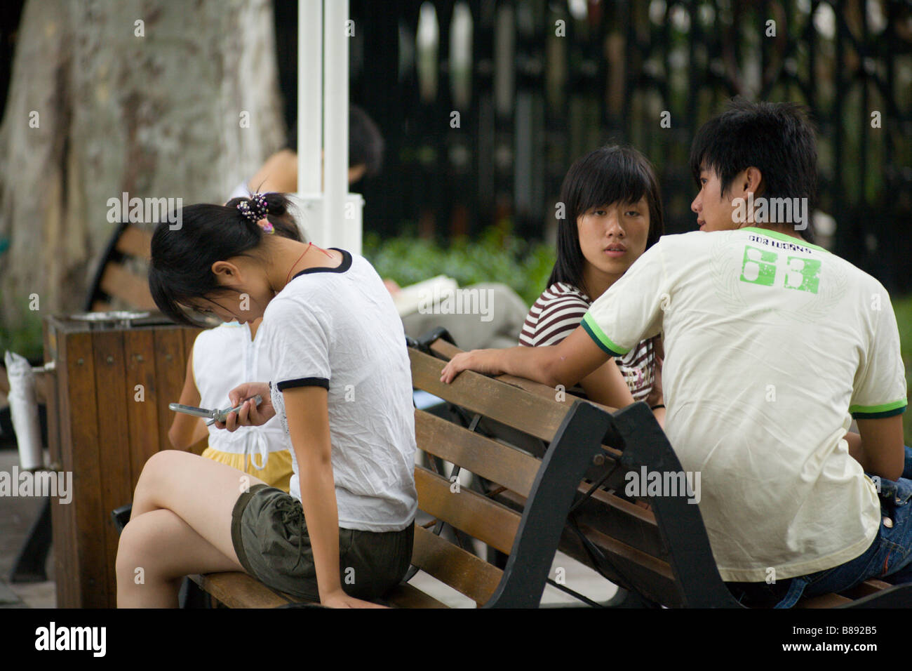 Chinese youth relaxing in Jing An temple garden, Shanghai, China Stock ...