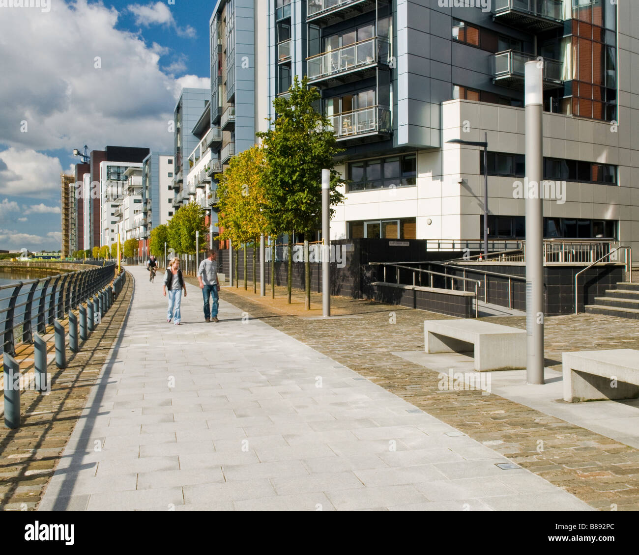 People walking along the Riverside Walkway at Glasgow Harbour Stock ...