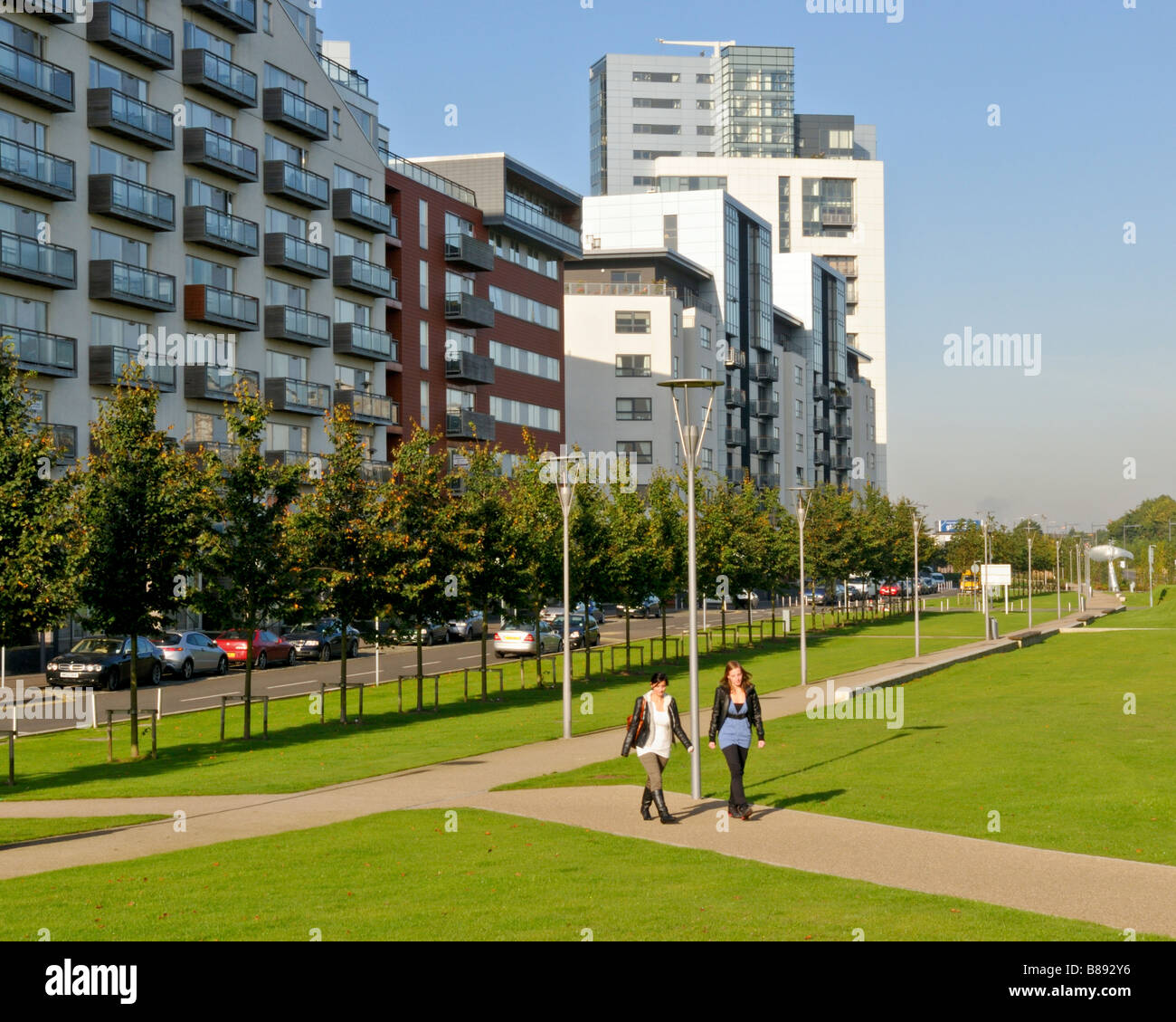 Two young women walking through the Linear Park at Glasgow Harbour ...