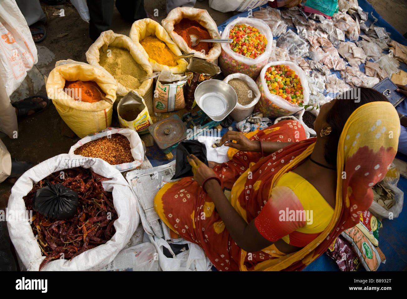 Spices for sale at a street market spice stall, with street seller ...
