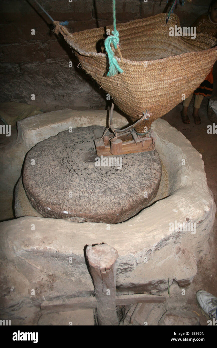 Moroccan grain grinding stone with basket feeder Stock Photo - Alamy