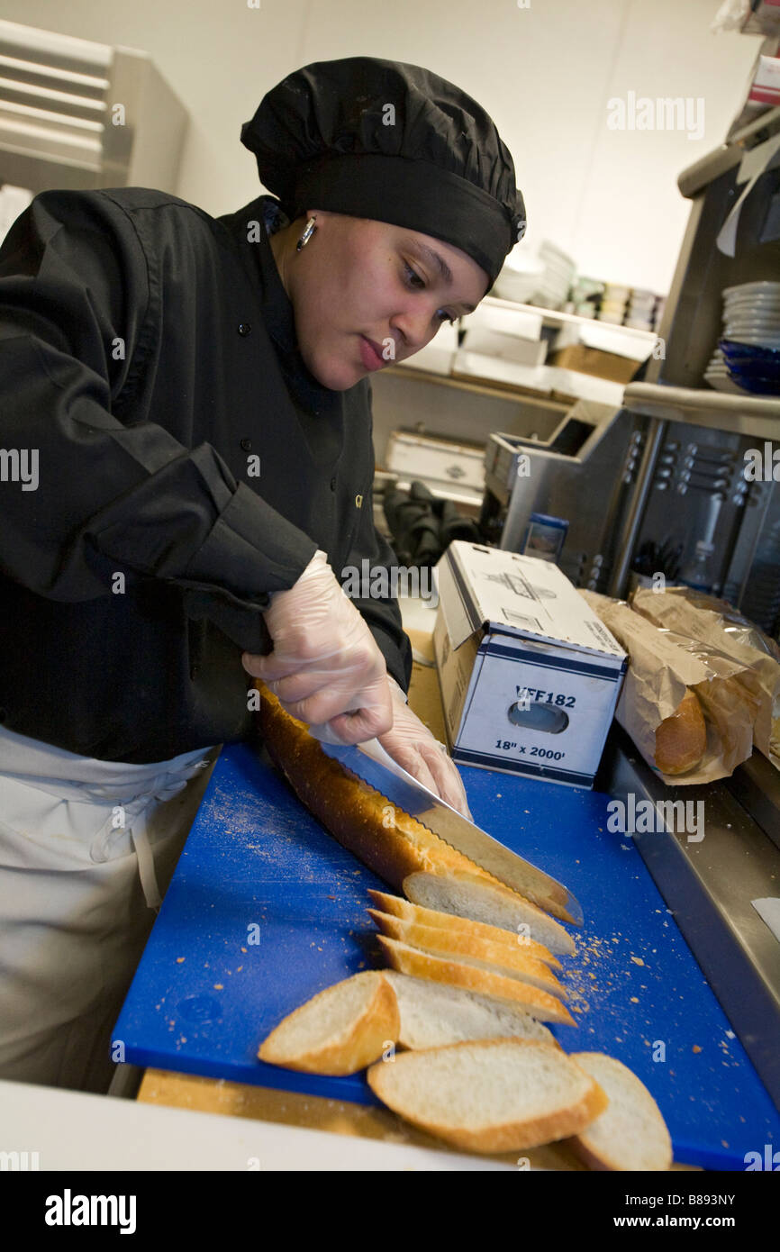 Detroit Michigan A worker slices bread in the kitchen of the Greektown ...