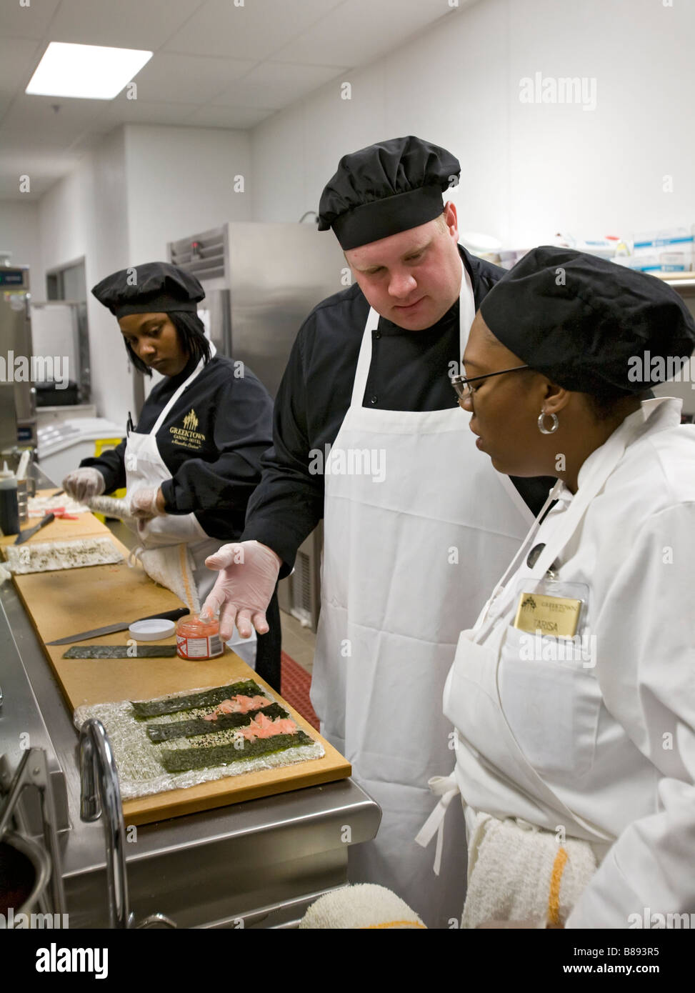 Restaurant Workers Make Sushi Stock Photo - Alamy