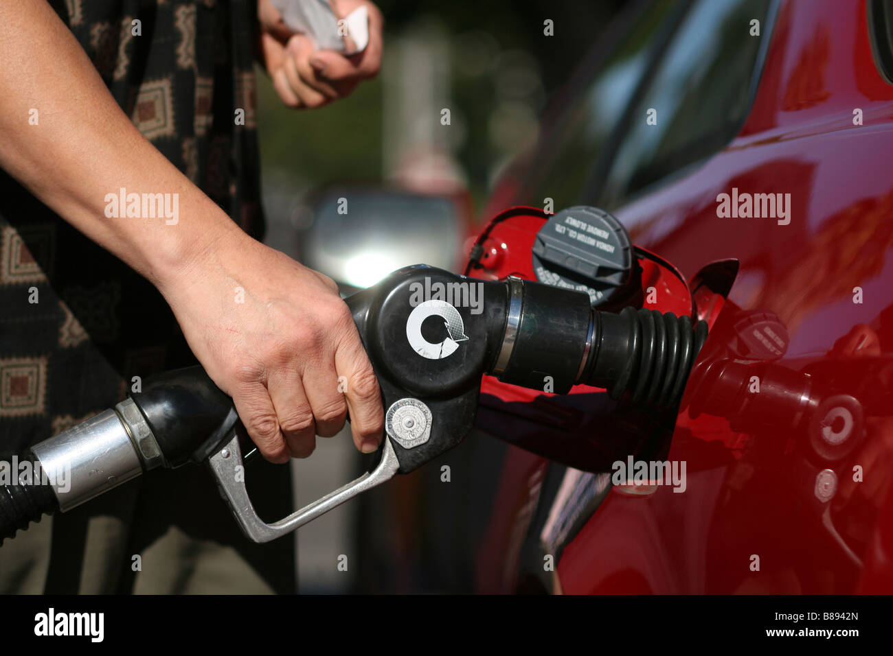 Filling up with gas Stock Photo - Alamy