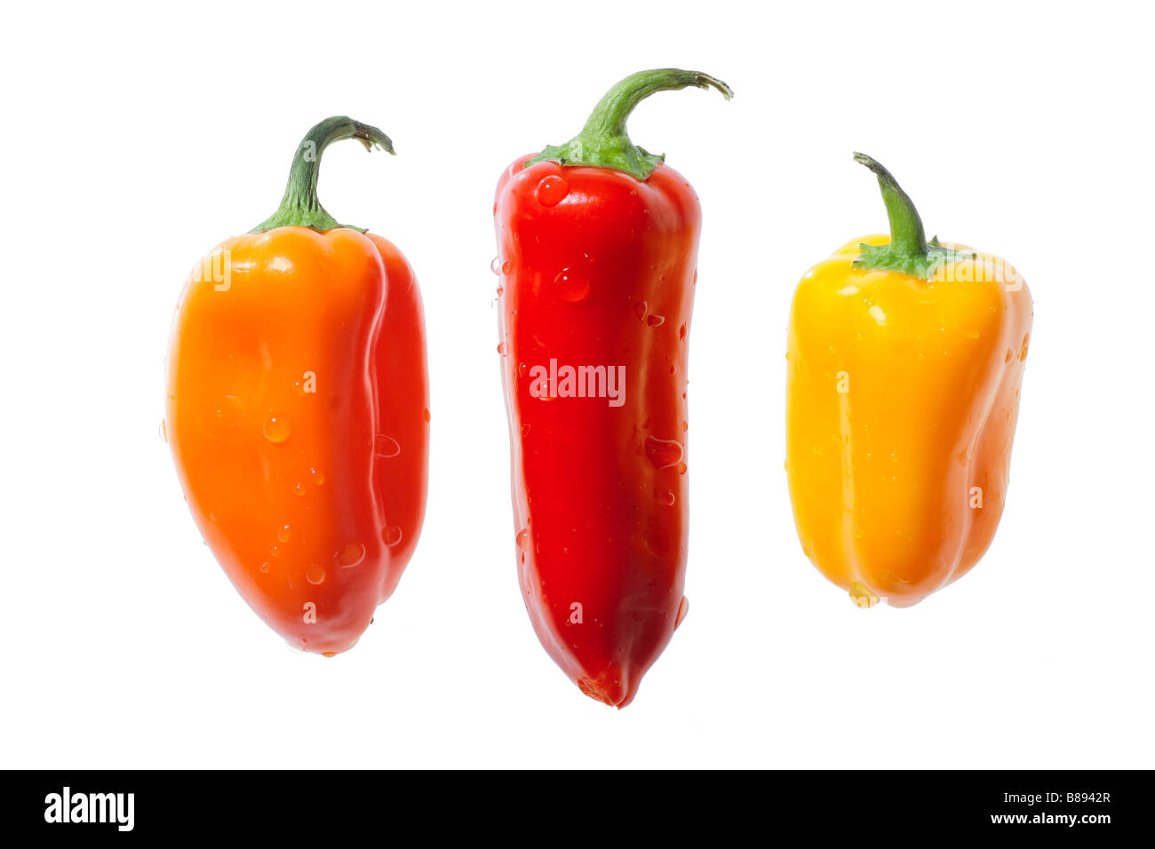 Three Fun Peppers Isolated On White Stock Photo - Alamy