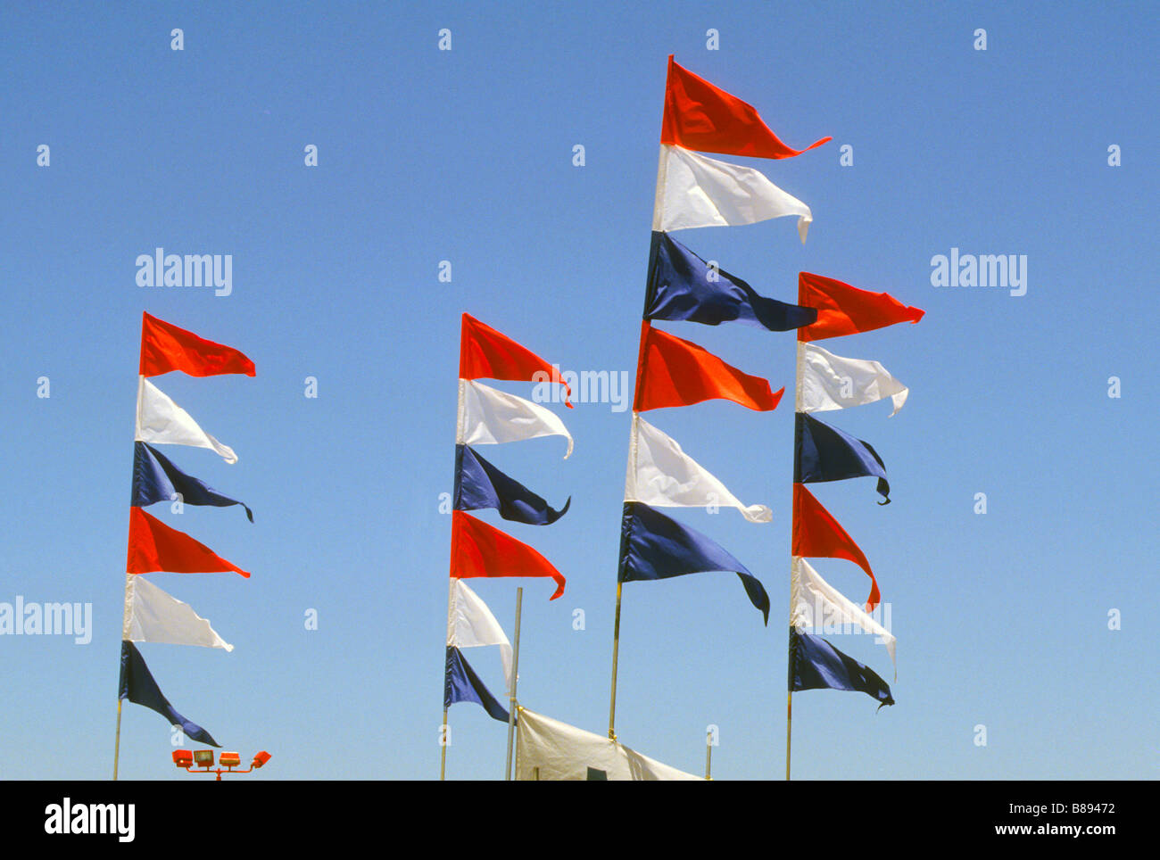 Flags blow in the wind at carnival Stock Photo - Alamy