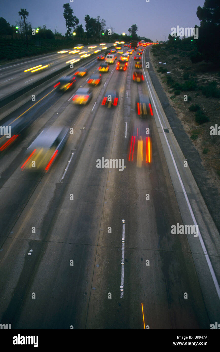 Cars blur as they speed along California freeway oil economy transport ...