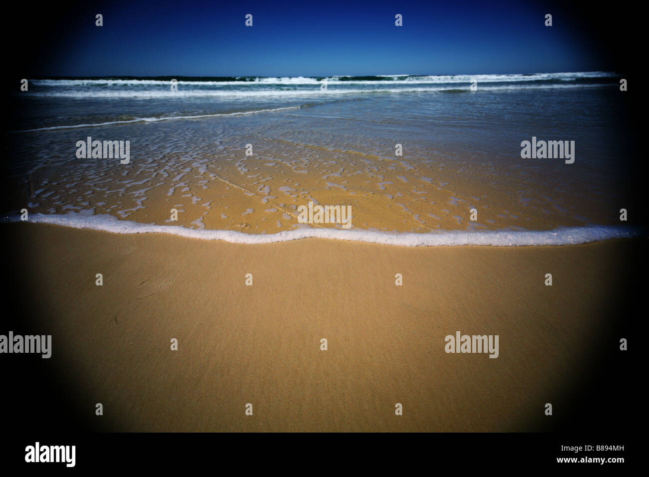 Wide angle photo of a beach burned edges round Stock Photo - Alamy