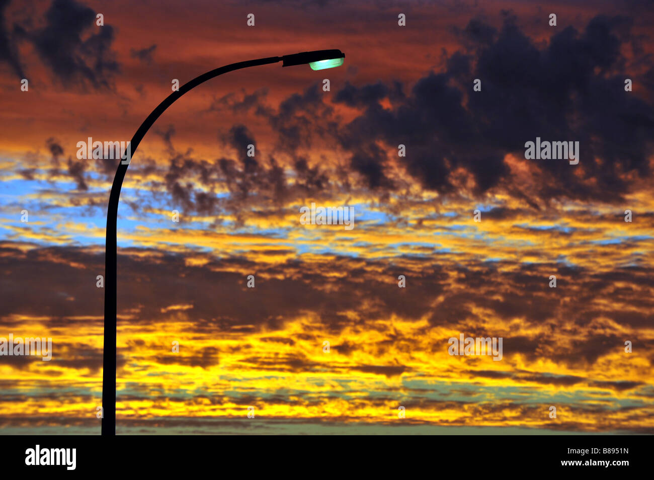 A single street light at sunset Stock Photo - Alamy