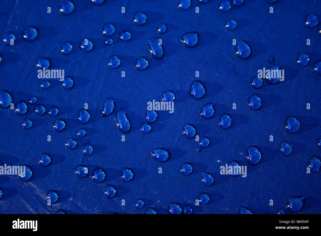 dew drops on a blue fabric Stock Photo - Alamy