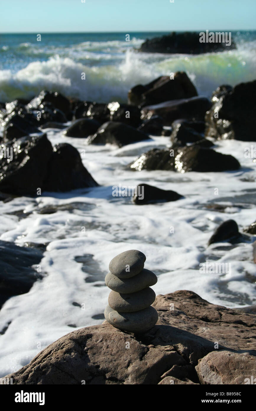 stack of stones built on a rocky coastline Stock Photo - Alamy