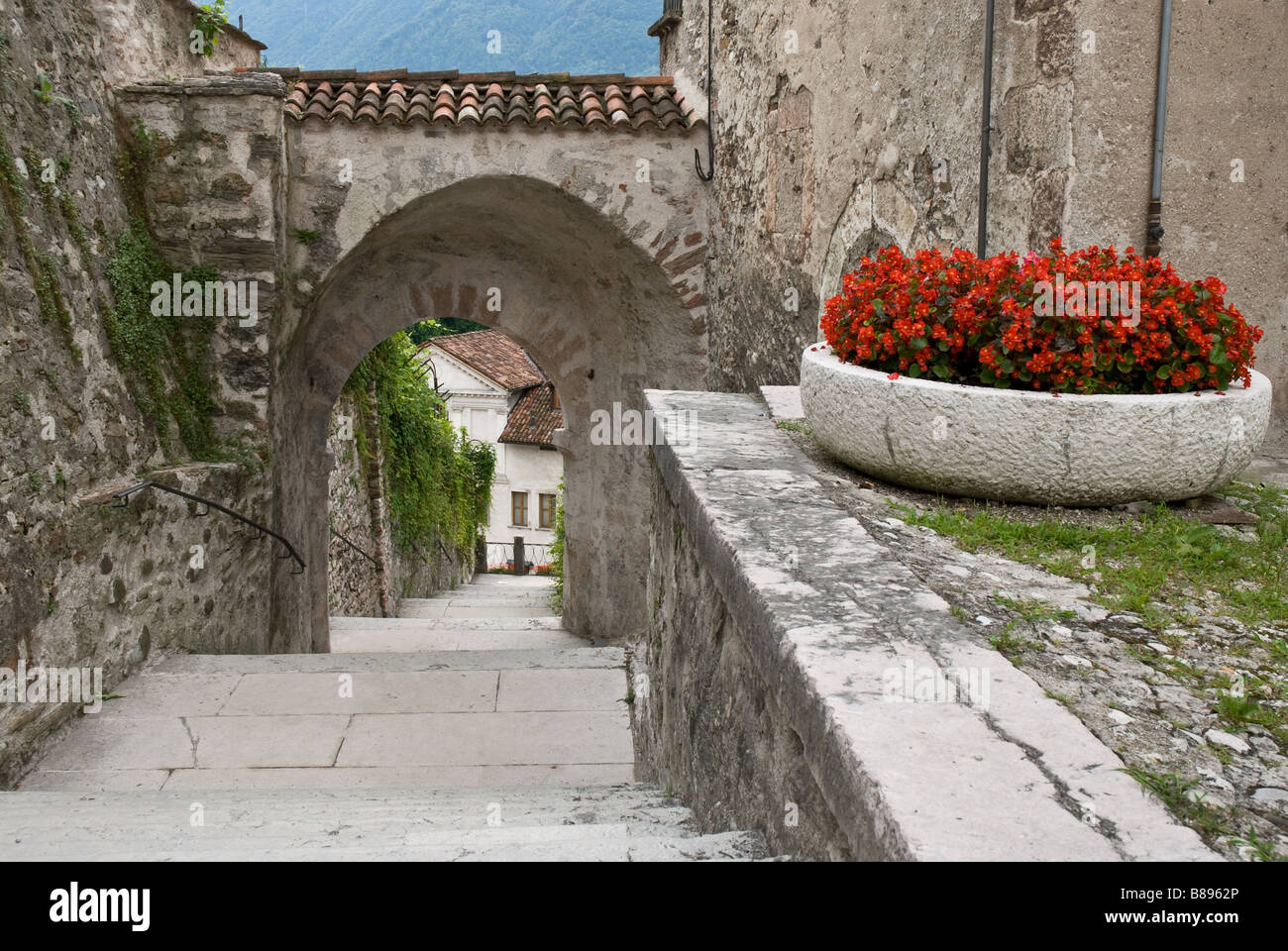 Medieval stone stairs with arch door Stock Photo - Alamy